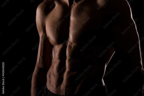 Muscular And Defined Six Pack Abs On Handsome Male Model Posing On