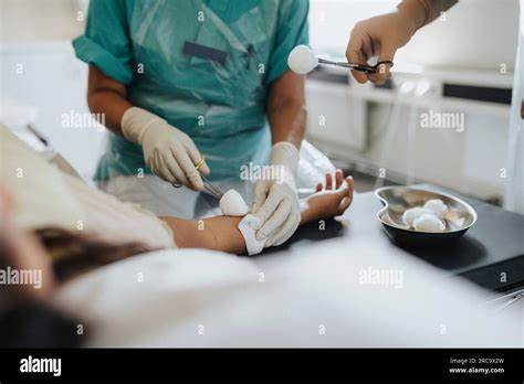 Male And Female Surgeons Operating Woman In Hospital Stock Photo Alamy