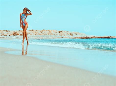 Outdoor Fashion Photo Of Beautiful Happy Slender Woman At Sea Beach