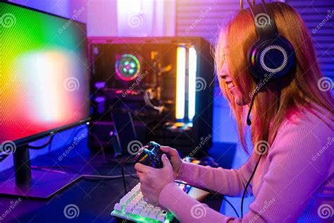 Gamer Using Joystick Controller For Virtual Tournament Plays Online