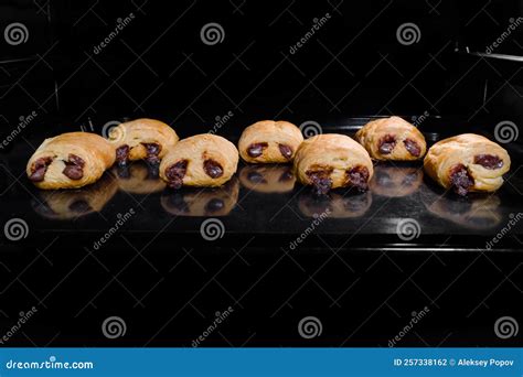 Seven Baked Mini Homemade Buns With Chocolate Filling Front View