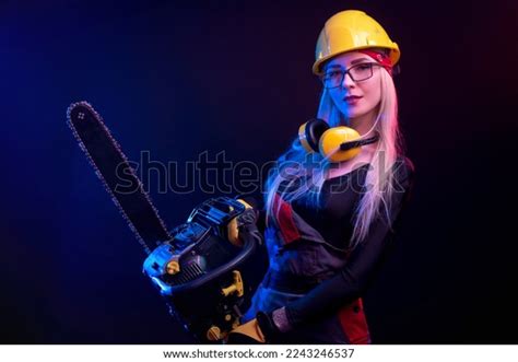 Sexy Girl Chainsaw Construction Jumpsuit Helmet Stock Photo