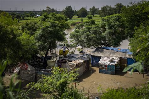 See Pics Yamuna Flows Above Danger Mark In Delhi