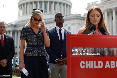 Actress And Model Paris Hilton Listens As Activist Caroline Cole