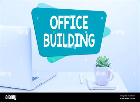 Sign Displaying Office Building Word Written On Commercial Buildings