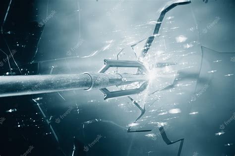Premium Photo Grey Arrow Breaking Glass