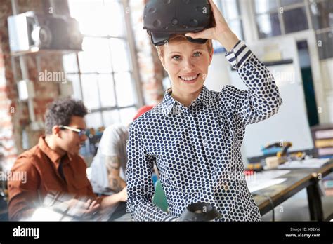 Portrait Smiling Female Computer Programmer Wearing Virtual Reality
