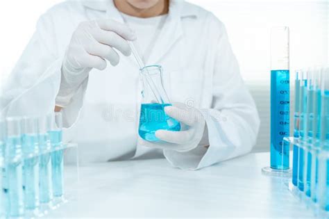 Scientist Analyze Biochemical Samples In Advanced Scientific Laboratory