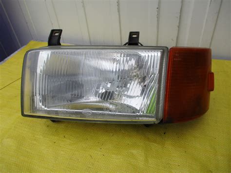 VW T4 TRANSPORTER LAMPA PRZEDNIA LEWA LEWY PRZÓD 12132028146
