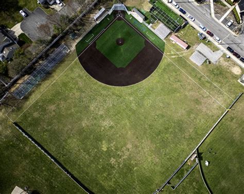 Newly Turfed Baseball Field With A Natural Grass Field From Directly
