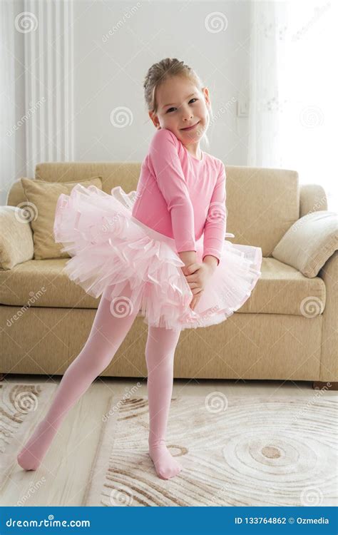 Cute Ballerina Splitting Her Legs On The Floor Royalty Free Stock Image