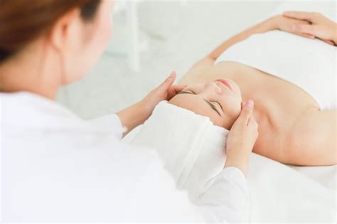 Premium Photo Midsection Of Woman Massaging Customer Lying On Table