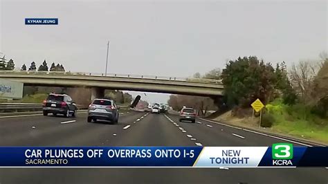Car Falls From Overpass Onto Highway Driver Miraculously Survives