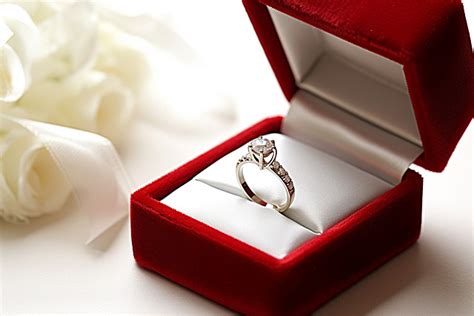 Red Wedding Box Of A Engagement Ring Inside And On A White Table