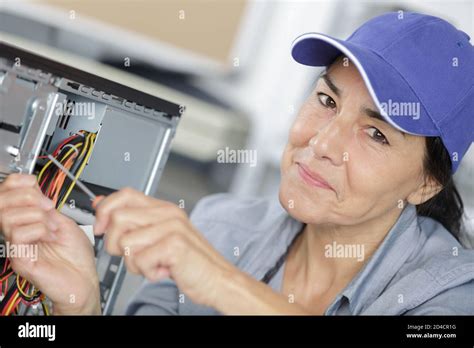 Woman Fixing A Desktop Computer Stock Photo Alamy