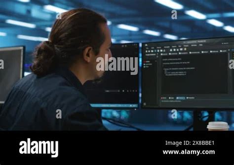 Computer Scientist In Server Hub Doing System Analysis Coding Doing