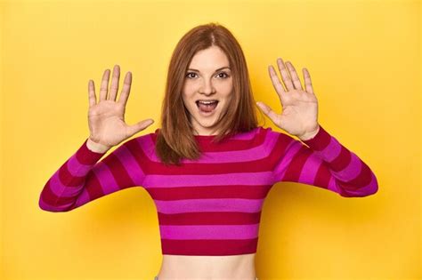 Premium Photo Redhead In Pinkred Striped Shirt Casual Look Receiving