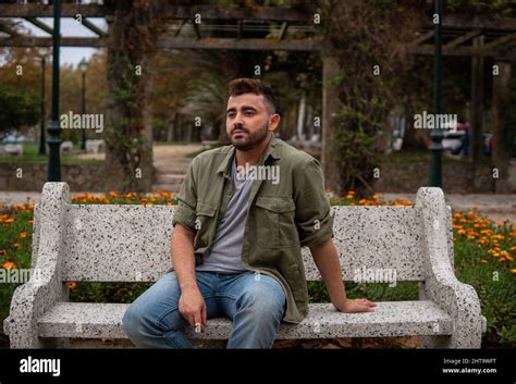 A Caucasian 24 Years Old Male On The Beach In Spain Sitting On A Park