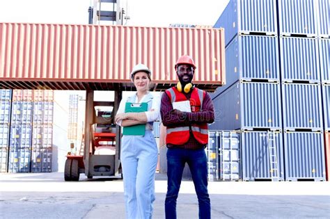 Portrait Of Two Workers With Safety Helmet At Logistic Shipping Cargo Containers Yard Beautiful