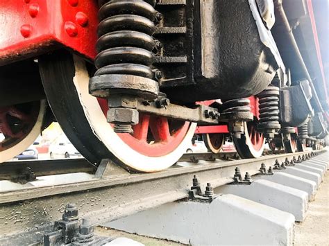 Premium Photo Large Iron Wheels Of A Red And Black Train Standing On