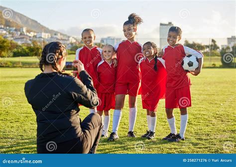 Soccer Photograph And Sports Coach With A Girl Team Posing For A