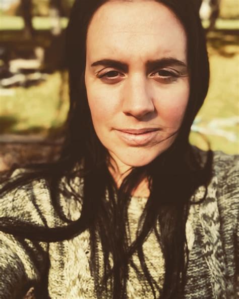 Premium Photo Portrait Of Smiling Woman Standing Outdoors