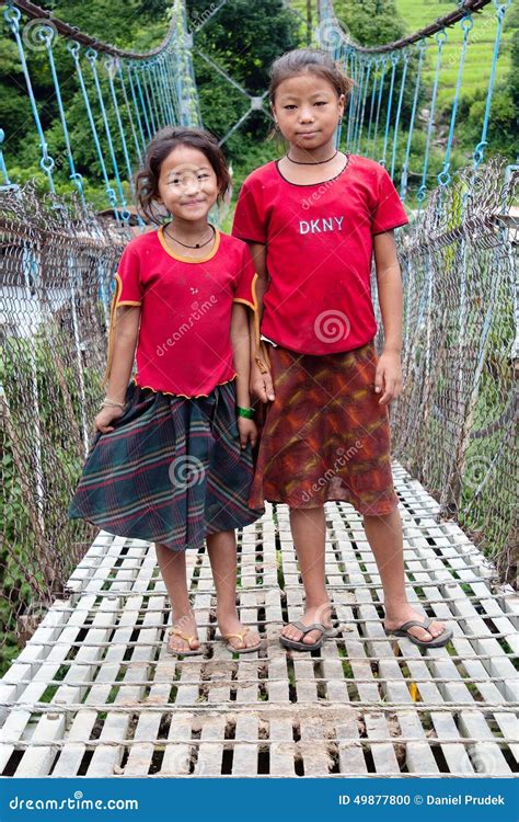 Little Nepalese Girls On Rope Hunging Suspension Bridge Editorial Image