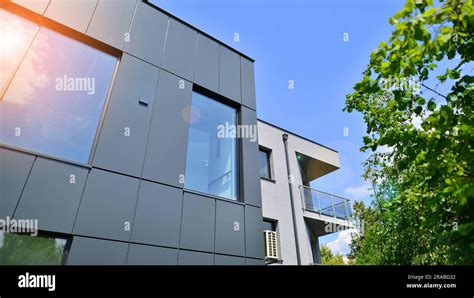 Graphite Facade And Large Windows On A Fragment Of An Office Building