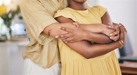 Love Hug And Hands Of Lesbian Couple In Their Home With Care Trust