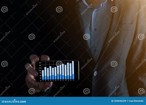 Business Man Holding Holographic Graphs And Stock Market Statistics