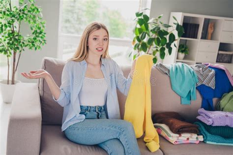 Photo Of Uncertain Unsure Girl Dressed Blue Shirt Having Nothing To