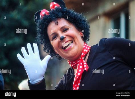 Person Dressed In A Costume Resembling Minnie Mouse A Well Known