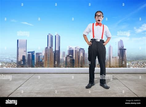 Asian Nerd With Ugly Face Standing With Cityscapes Background Stock Photo Alamy