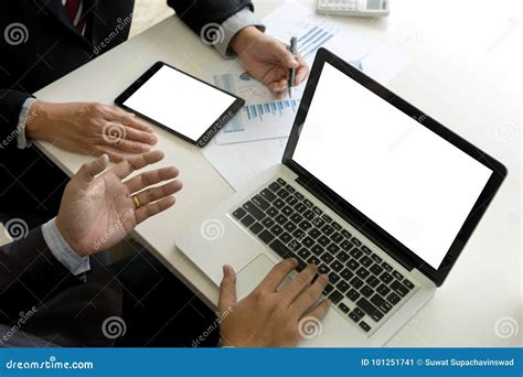Two Businessman Working Use Computer And Analysis Paper Graph On Stock