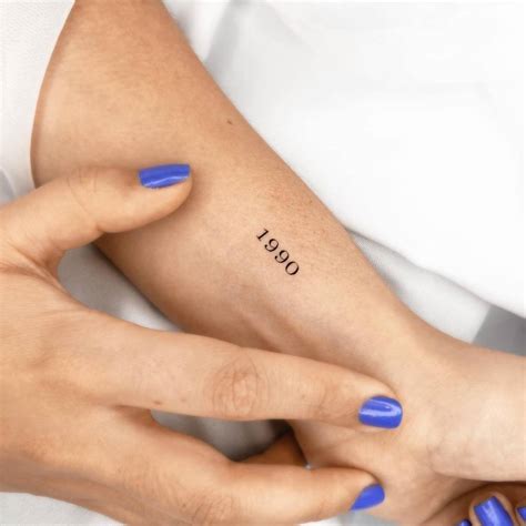 1990 Lettering Tattoo Done On The Wrist