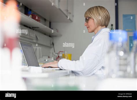 Scientist Using Laptop In Laboratory Stock Photo Alamy