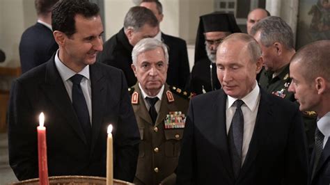Russias Putin Makes Rare Visit To Syria Meets Assad