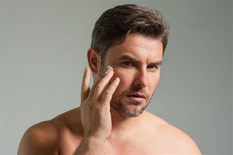 Premium Photo Aged Care Beauty Man With Cosmetic Cream Male Spa Model