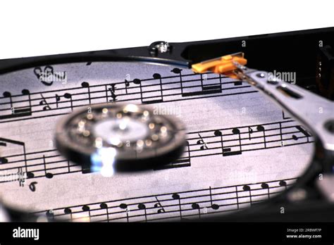 Hard Disk On A White Background With Reflection Of Music Notes Stock