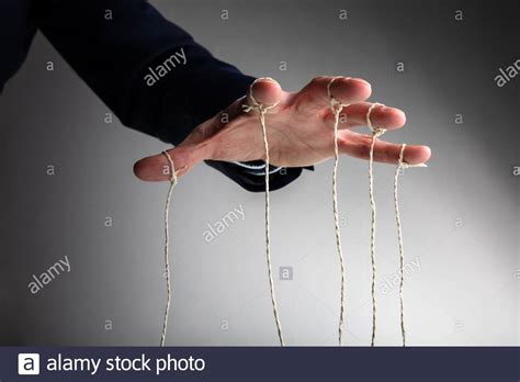 Man Hand Puppet Strings High Resolution Stock Photography And Images Alamy