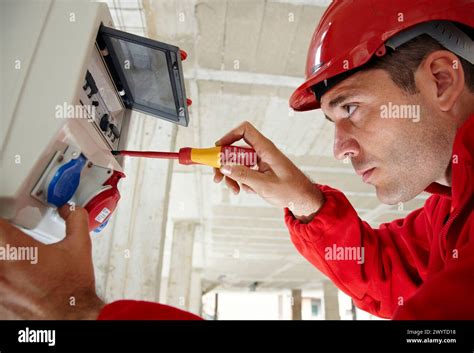 Worker Using Screwdriver In Construction Site Fuse Box Stock Photo Alamy