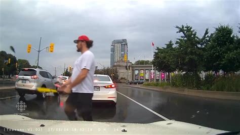 Dashcam Captures Man Hitting Vehicle With Baseball Bat In Road Rage