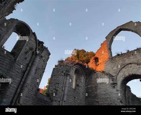 An Expansive Structure Featuring Grand Architectural Elements Such As Classical Columns Set