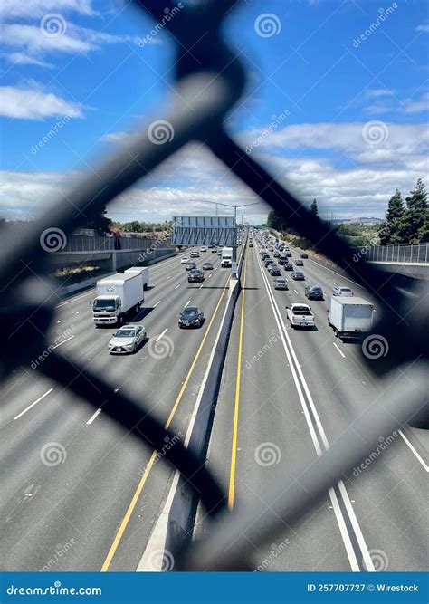 Vertical View Down The Freeway Hwy 880 Through A Chain Link Fence Overpass Stock Image Image