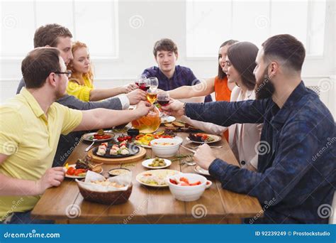 People Say Cheers Clink Glasses At Festive Table Dinner Party Stock
