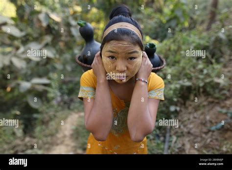 An Indigenous Girl Carries Water Pots As She Collected From Waterfall