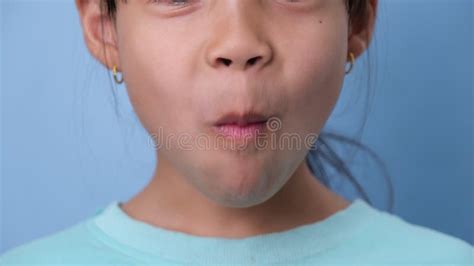 Close Up Of Smiling Young Girl Revealing Her Beautiful White Teeth On A