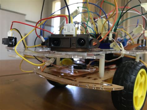 developing an analog wall following robot using pid controllers by