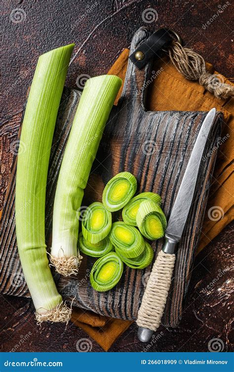 Sliced Green Leeks On Wooden Cutting Board Dark Background Stock Image