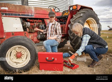 Boy Fixing Tractor Hi Res Stock Photography And Images Alamy
